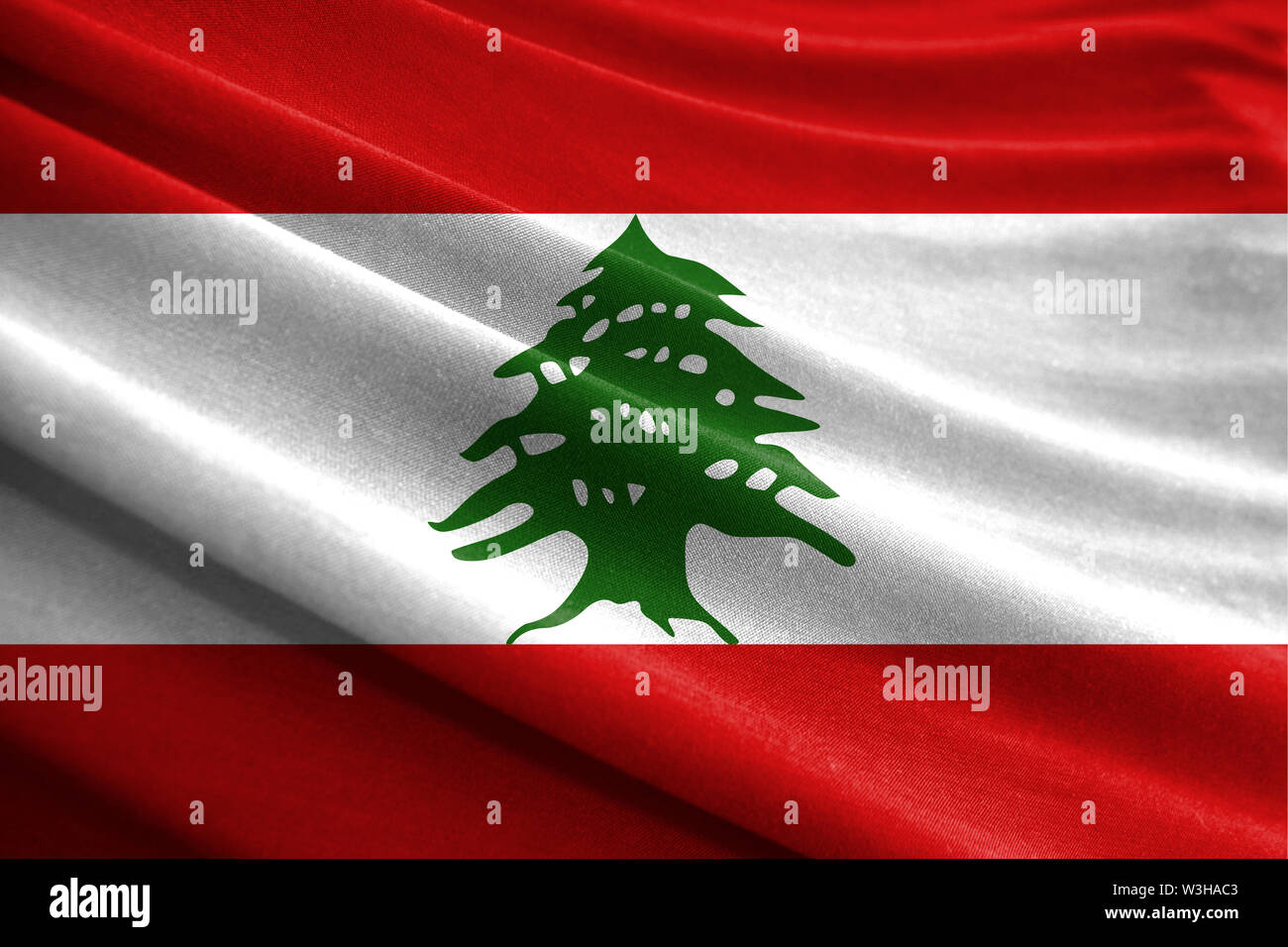 Realistic flag of Lebanon on the wavy surface of fabric Stock Photo - Alamy