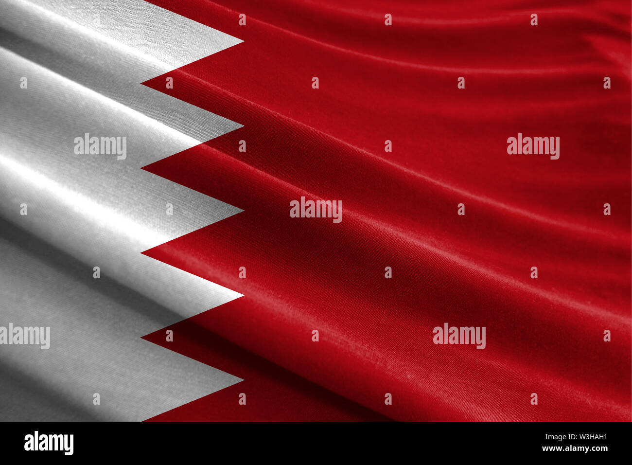 Realistic flag of Bahrain on the wavy surface of fabric Stock Photo - Alamy
