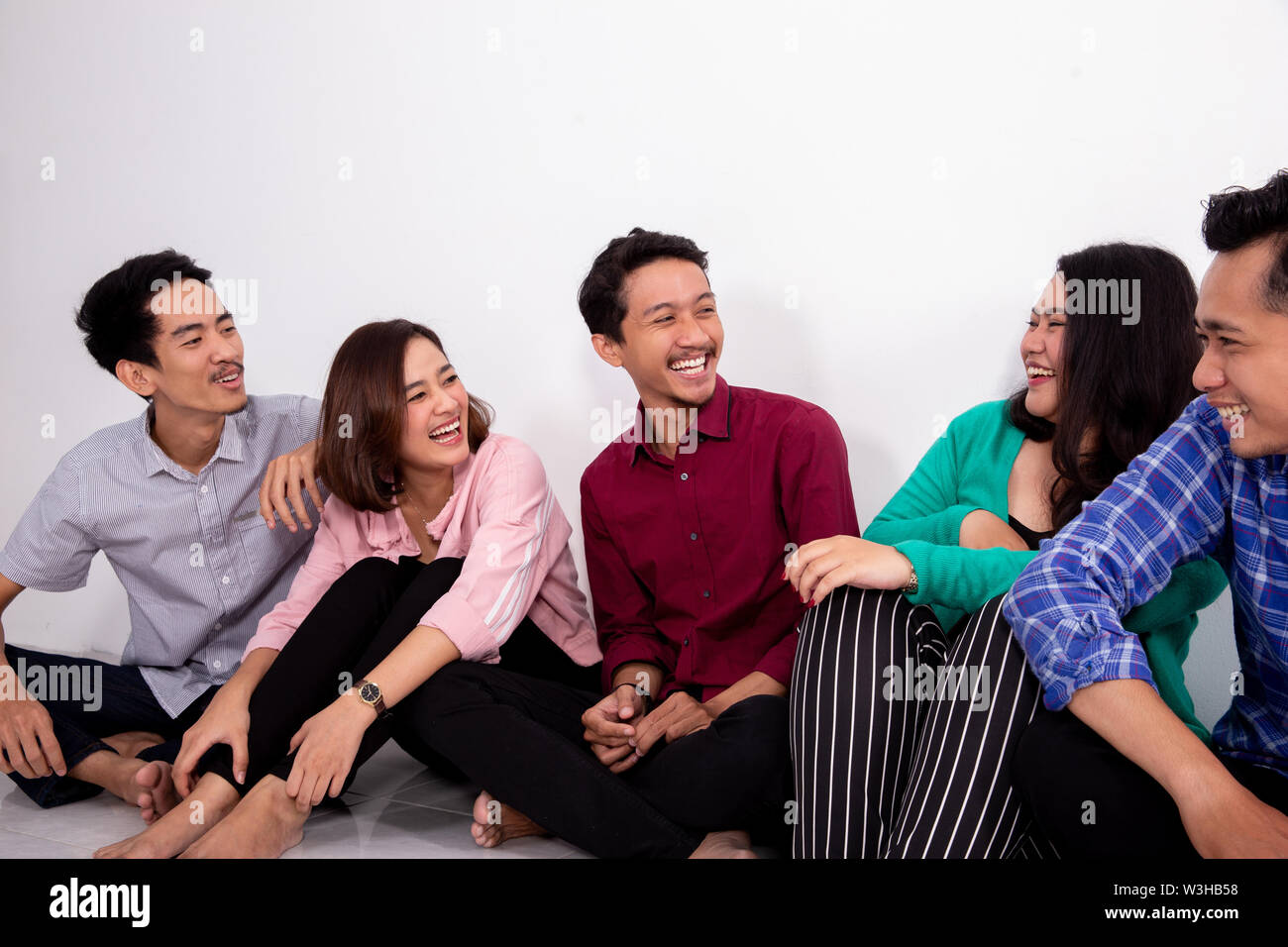 gather with school friends joking together Stock Photo - Alamy