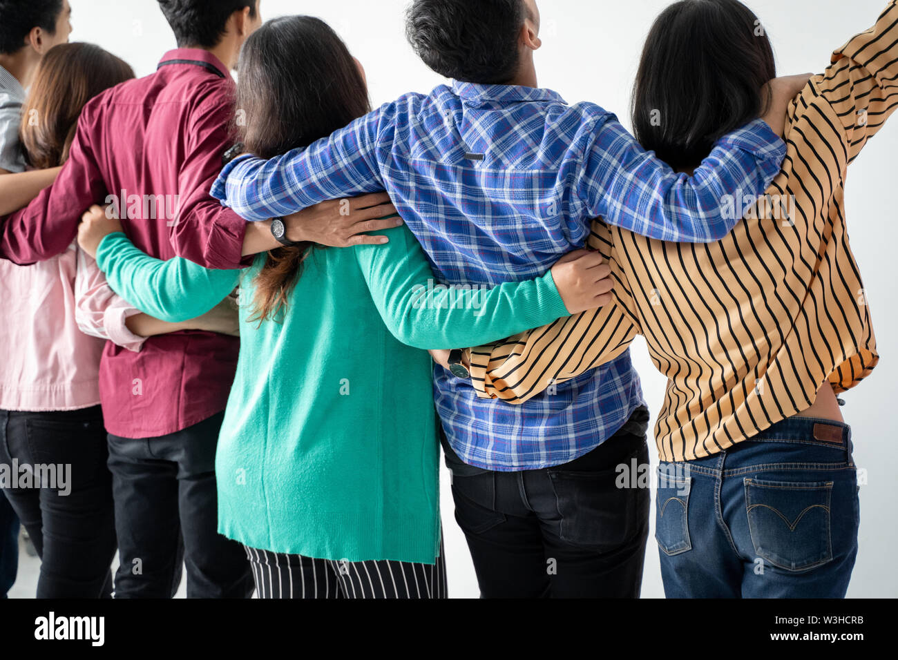 back view of friend holding hands and hug each other over white ...