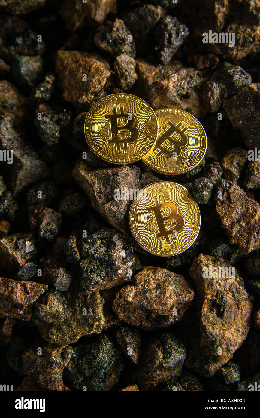 Vertical top view of a close-up of a bitcoin stack of gold coins ...
