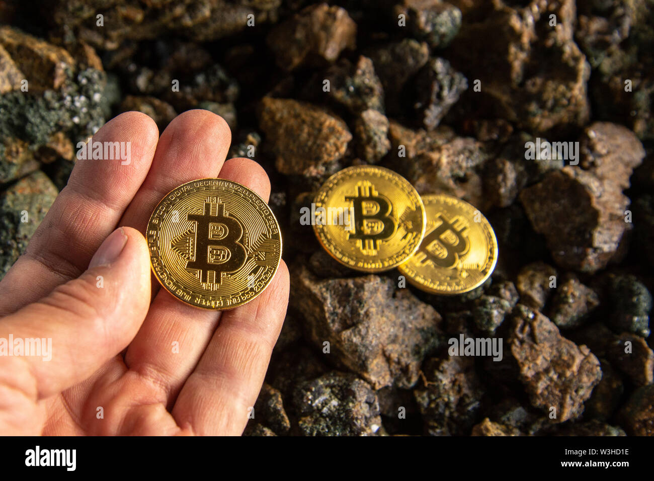 Vertical top view of a close-up of a bitcoin stack of gold coins ...