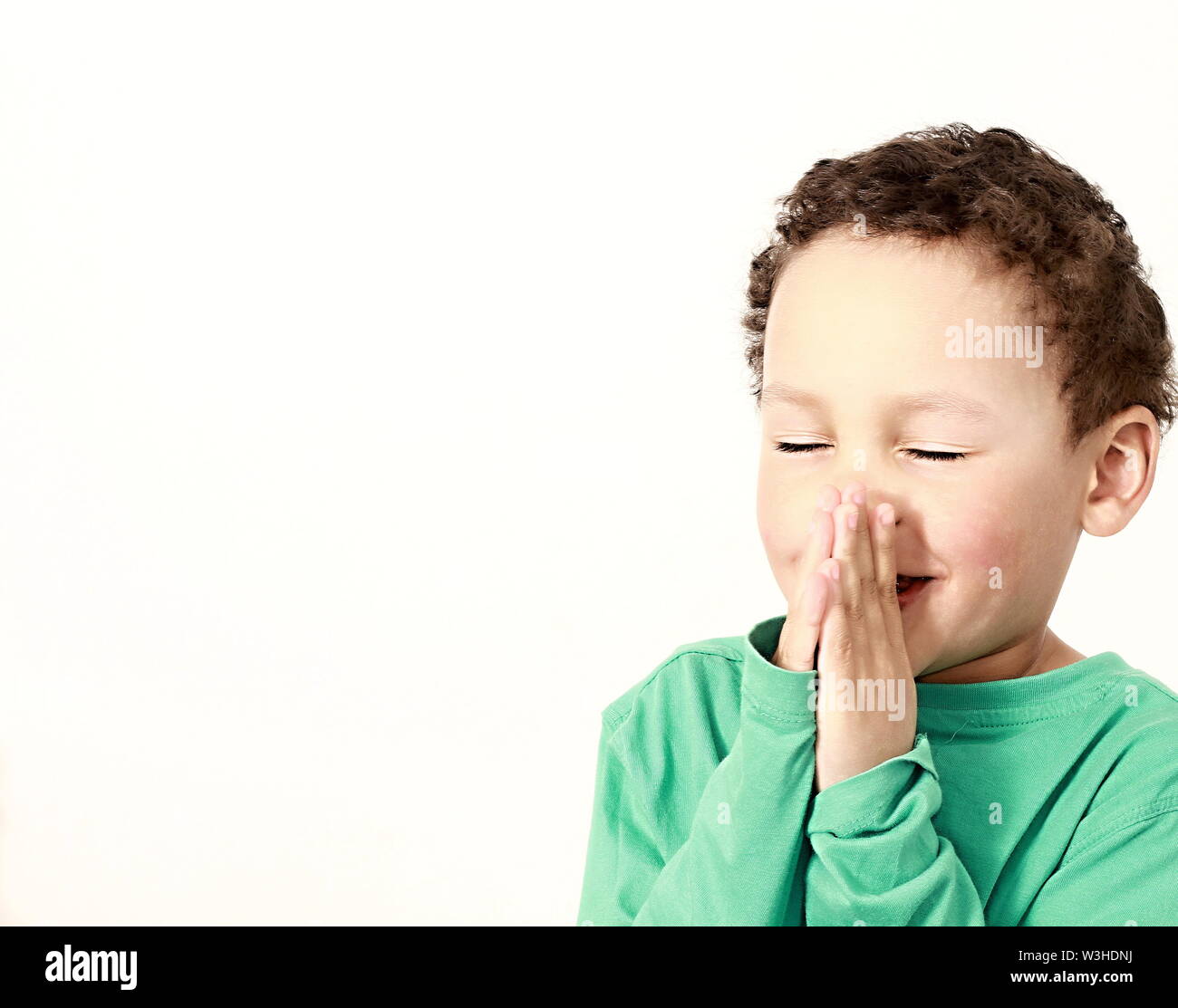 little boy praying to God and being religious stock image with hands ...