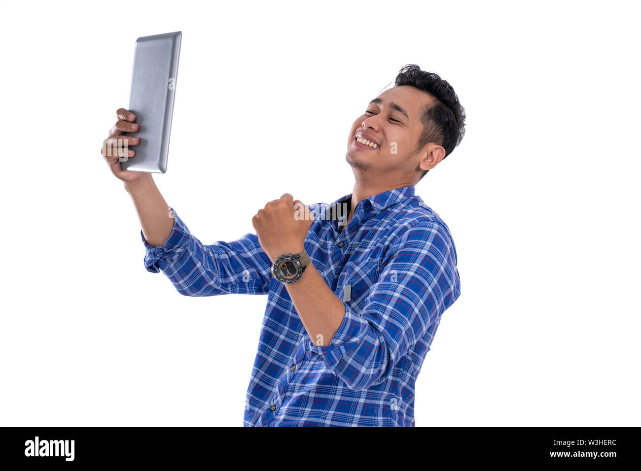 portrait of asian young man happy looking screen tab with isolated ...