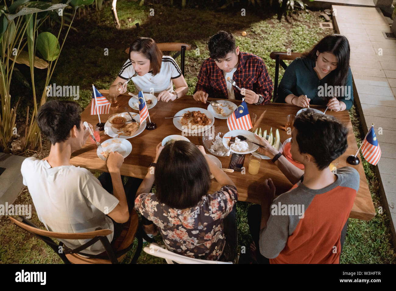 asian people dinner garden party at home with friend together in the ...