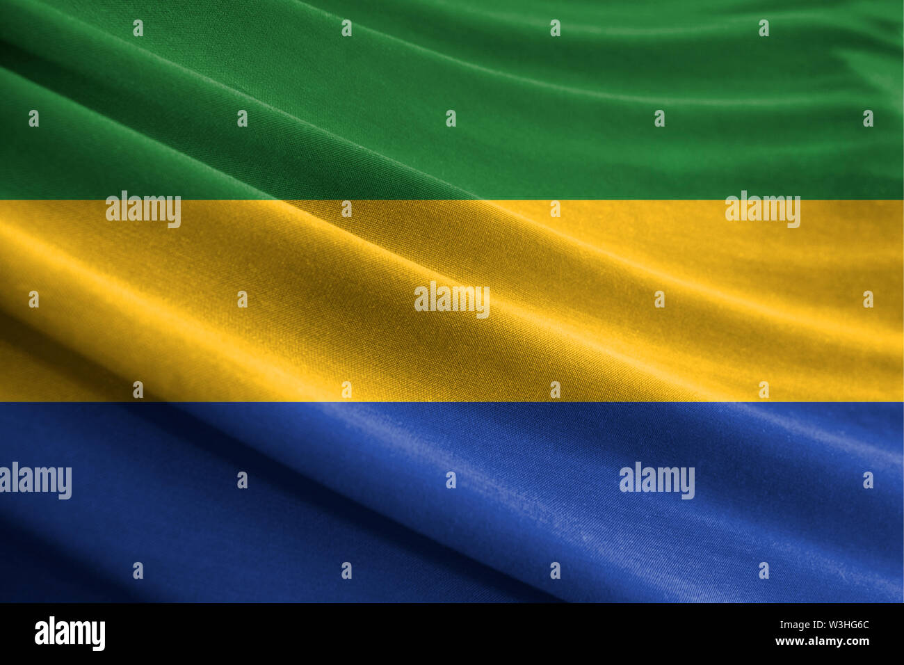 Realistic flag of Gabon on the wavy surface of fabric Stock Photo - Alamy