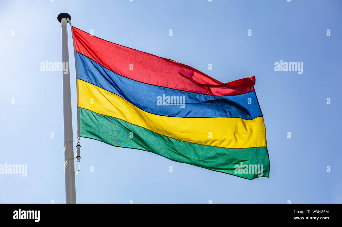 Mauritius flag, Mauritius national symbol waving against clear blue sky ...