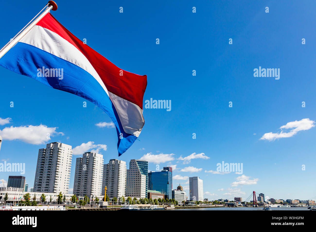 Netherlands flag waving, Highrise buildings background, sunny day in ...