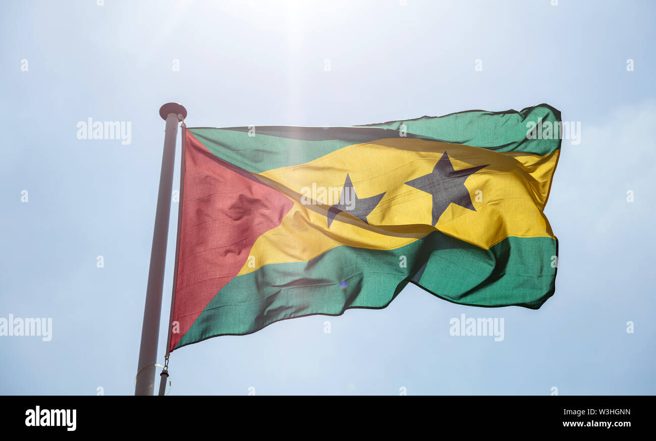 Saint Thomas and Prince Islands flag, National symbol waving against ...