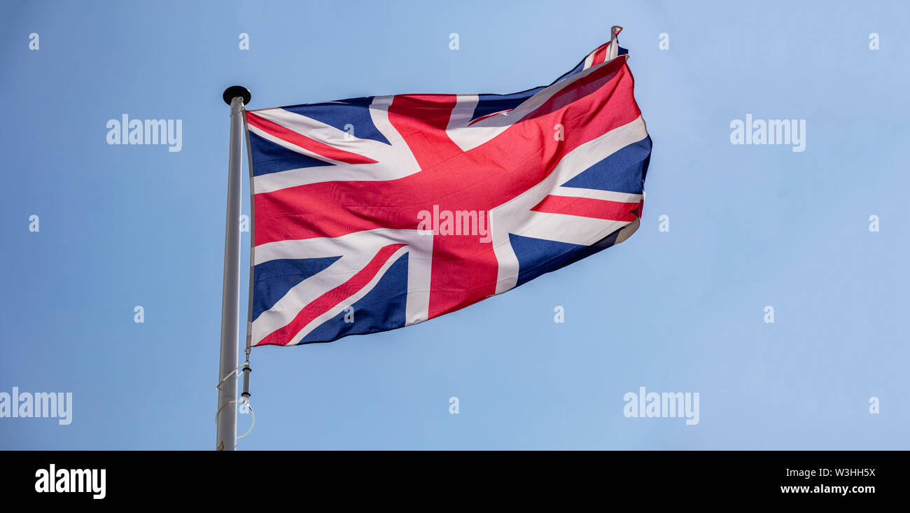 United Kingdom flag, Great Britain national symbol waving against clear ...