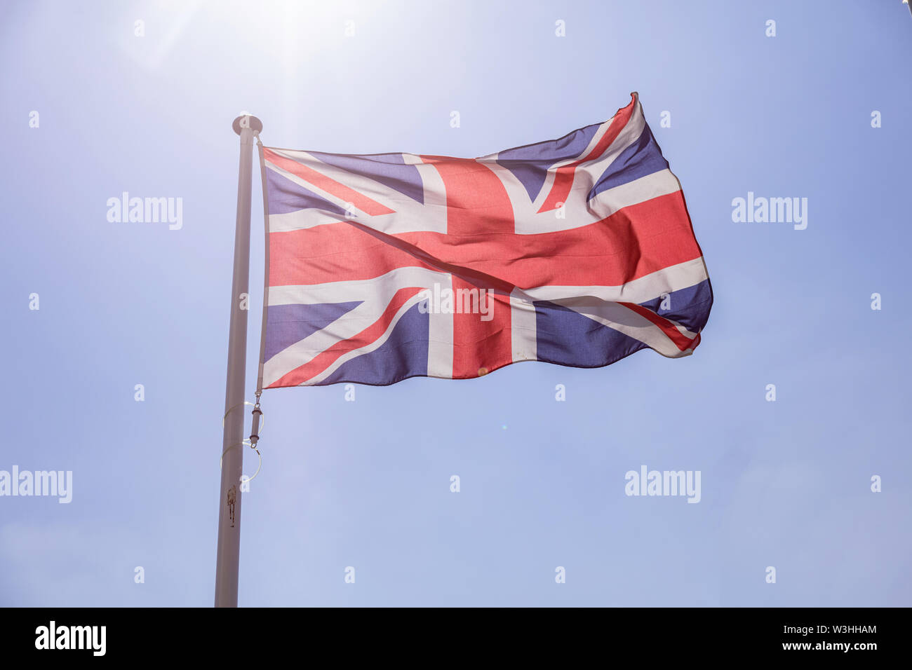 United Kingdom flag, Great Britain national symbol waving against clear ...
