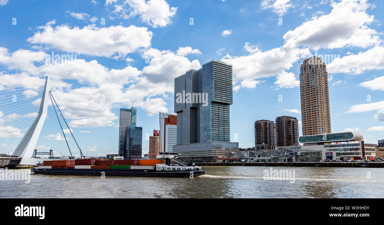 Container ship, Rotterdam cityscape and Erasmus bridge background ...