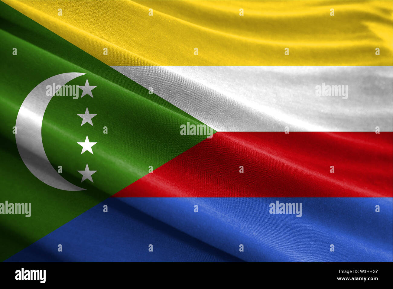 Realistic flag of Comoros on the wavy surface of fabric Stock Photo - Alamy