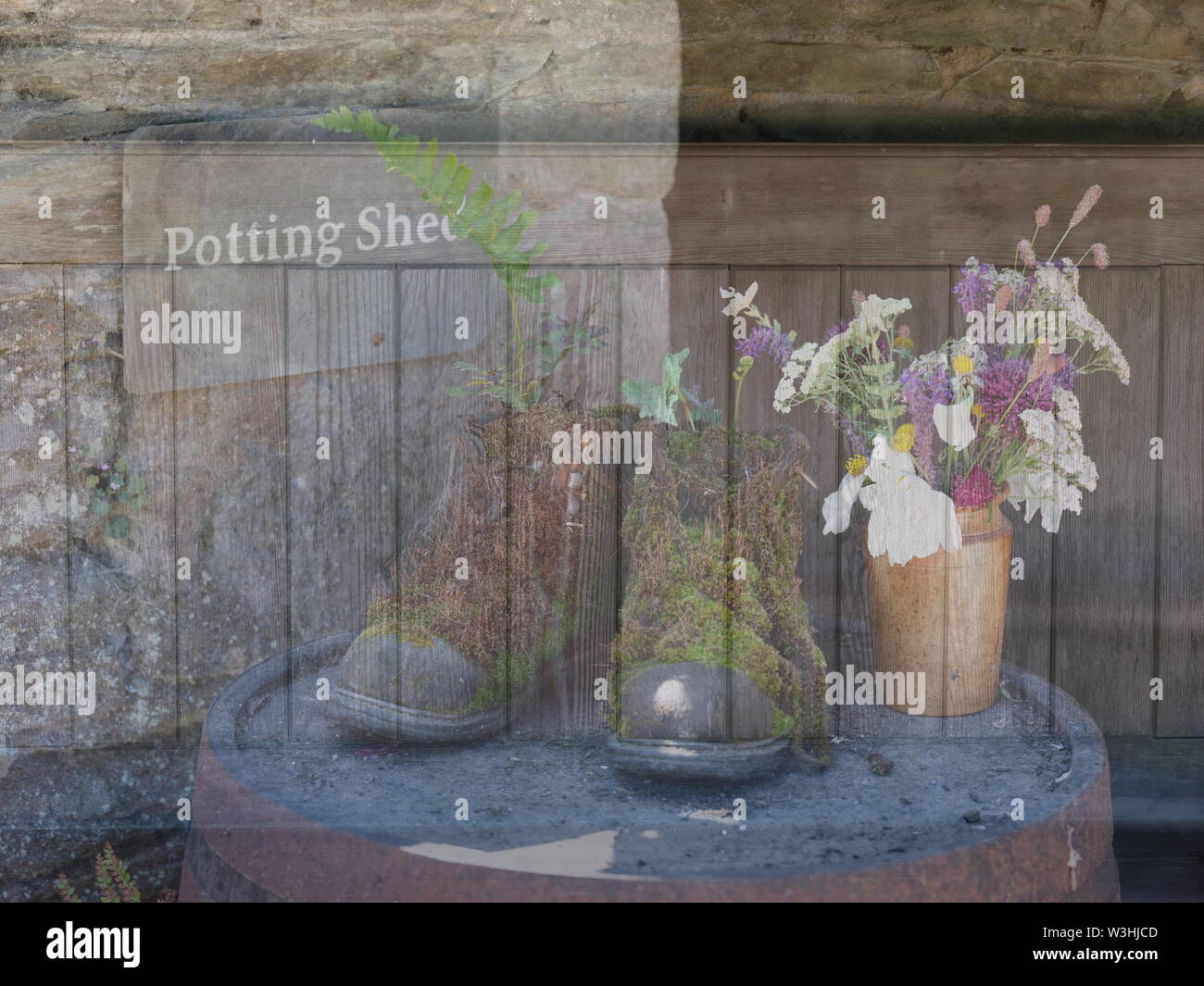 The Potting Shed boots slate sign and vase of flowers The Lost Gardens ...