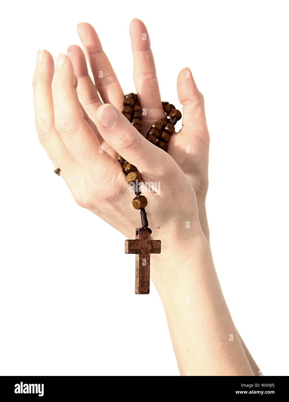 woman praying hand together reaching out with a crucifix and rosary ...