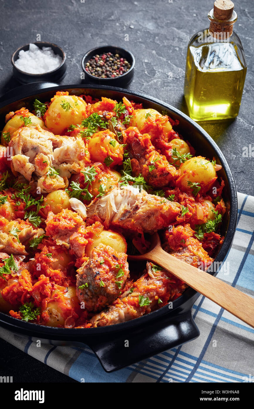 stewed hake fish cooked with new potatoes and vegetable sauce in a ...