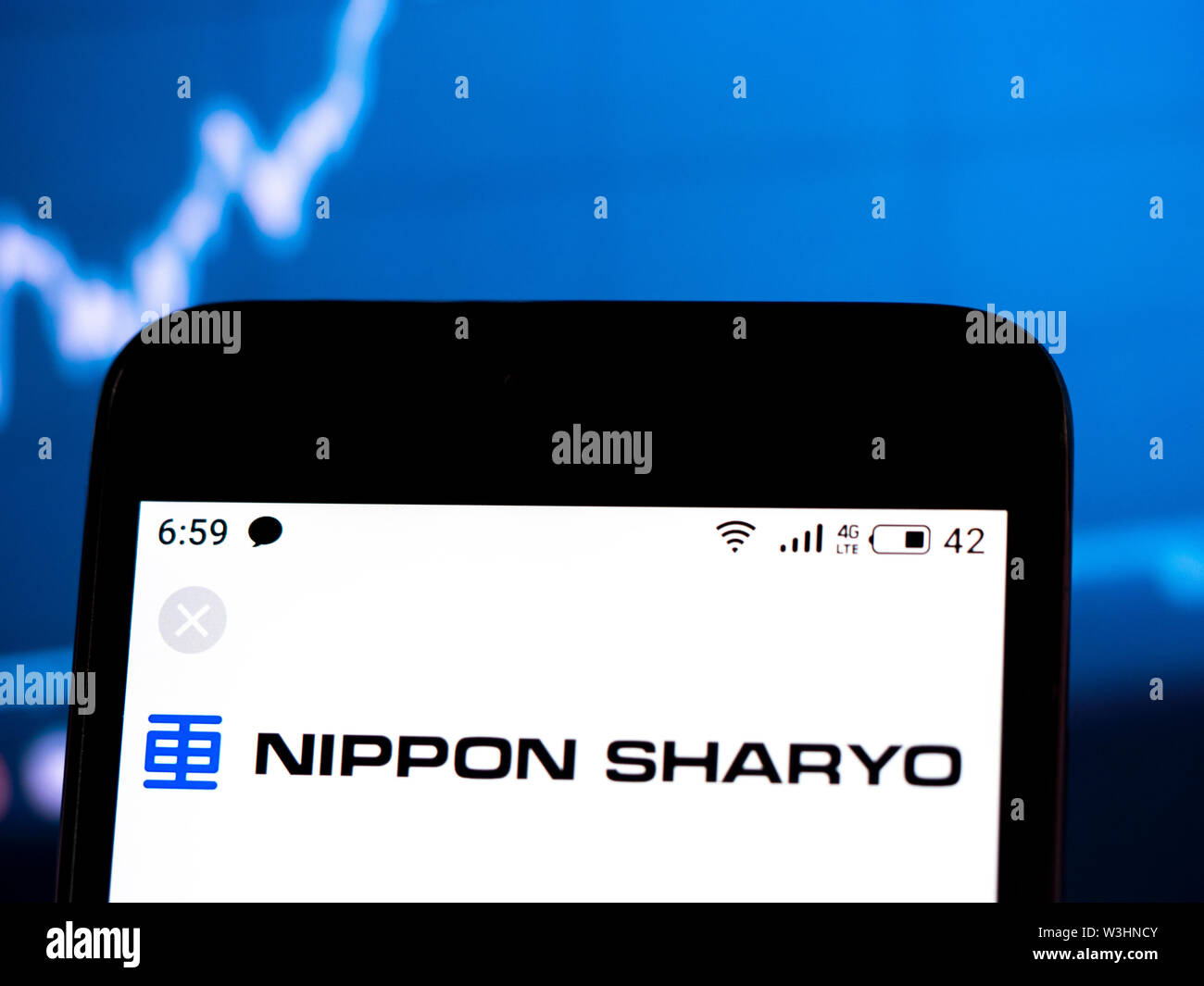 In this photo illustration the Nippon Sharyo, Ltd. logo is seen displayed on a smartphone Stock ...