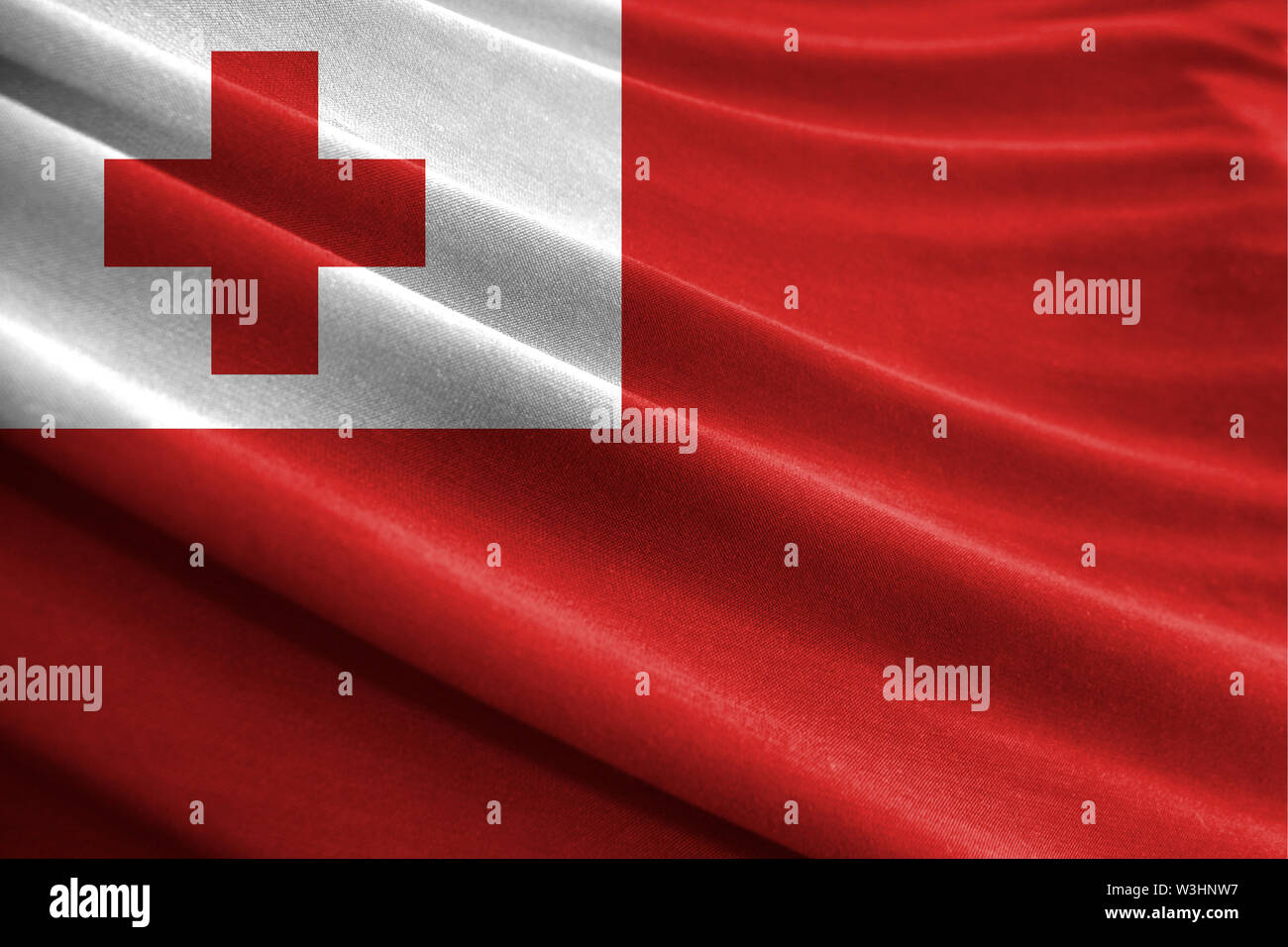 Realistic flag of Tonga on the wavy surface of fabric Stock Photo - Alamy