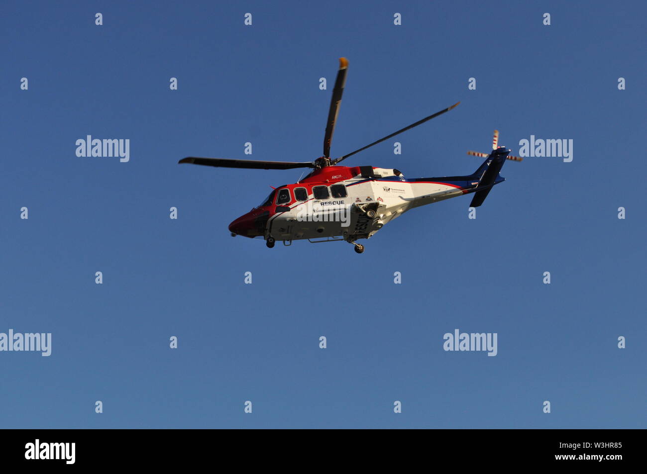 Rescue helicopter, in an emergency, collecting a patient from Nelly Bay ...