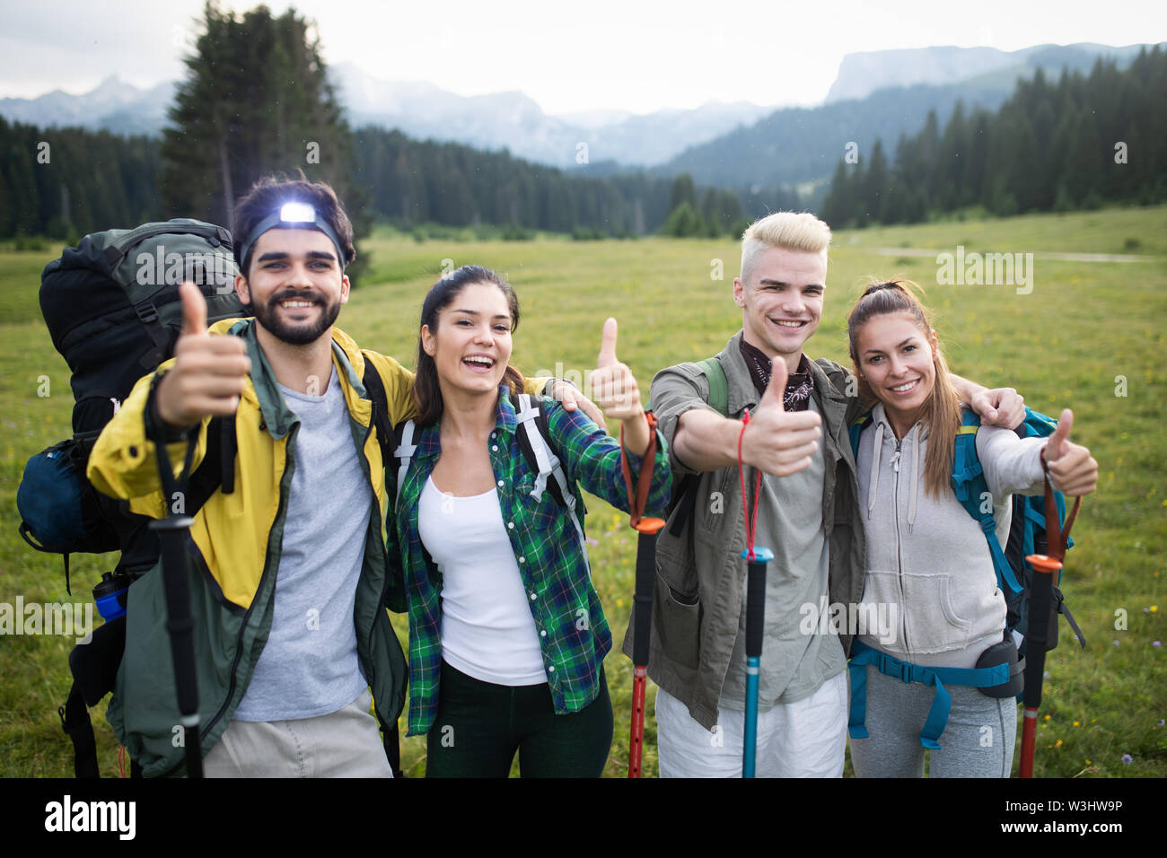 Successful Group of Happy Friends on Mountain Top, Cheering Stock Photo ...