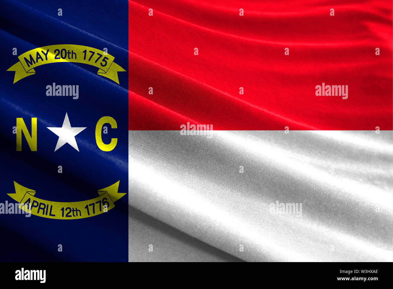 Realistic flag State of North Carolina on the wavy surface of fabric ...