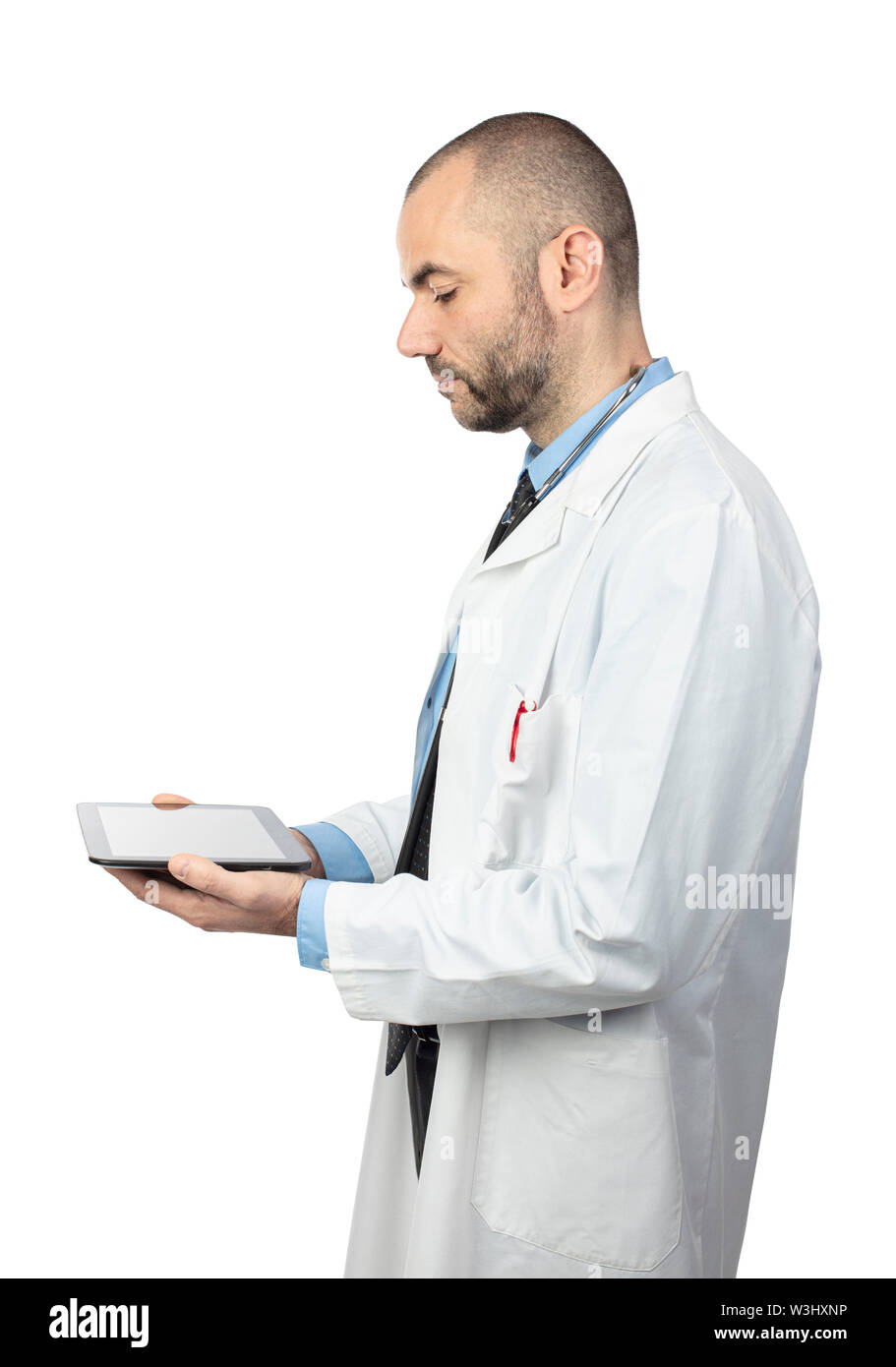 portrait of a doctor using a tablet for diagnosis, side view isolated ...