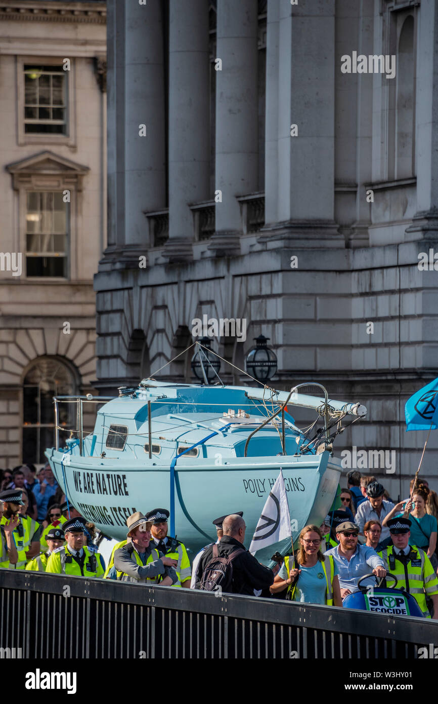London, UK. 15th July 2019. The boat is towed over Waterloo Bridge by ...