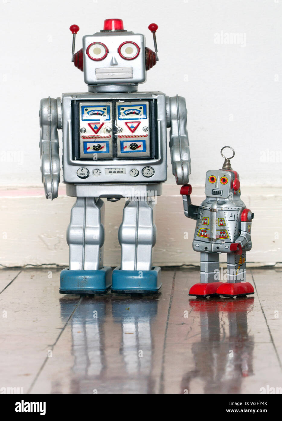 father and son robot toys on wooden floor Stock Photo - Alamy