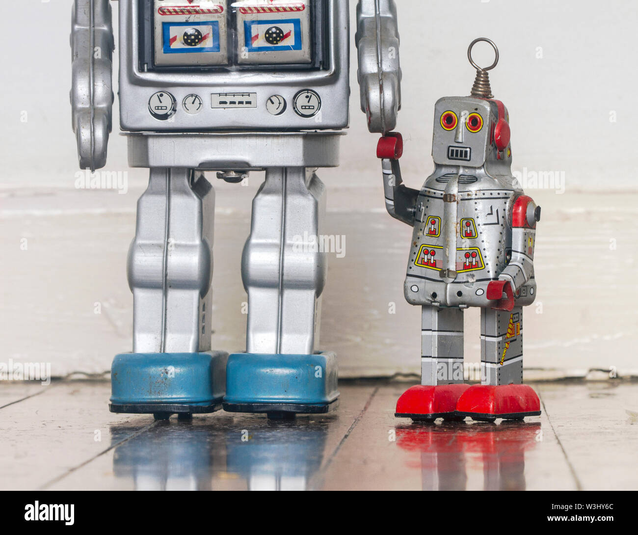 father and son robot toys on wooden floor Stock Photo - Alamy