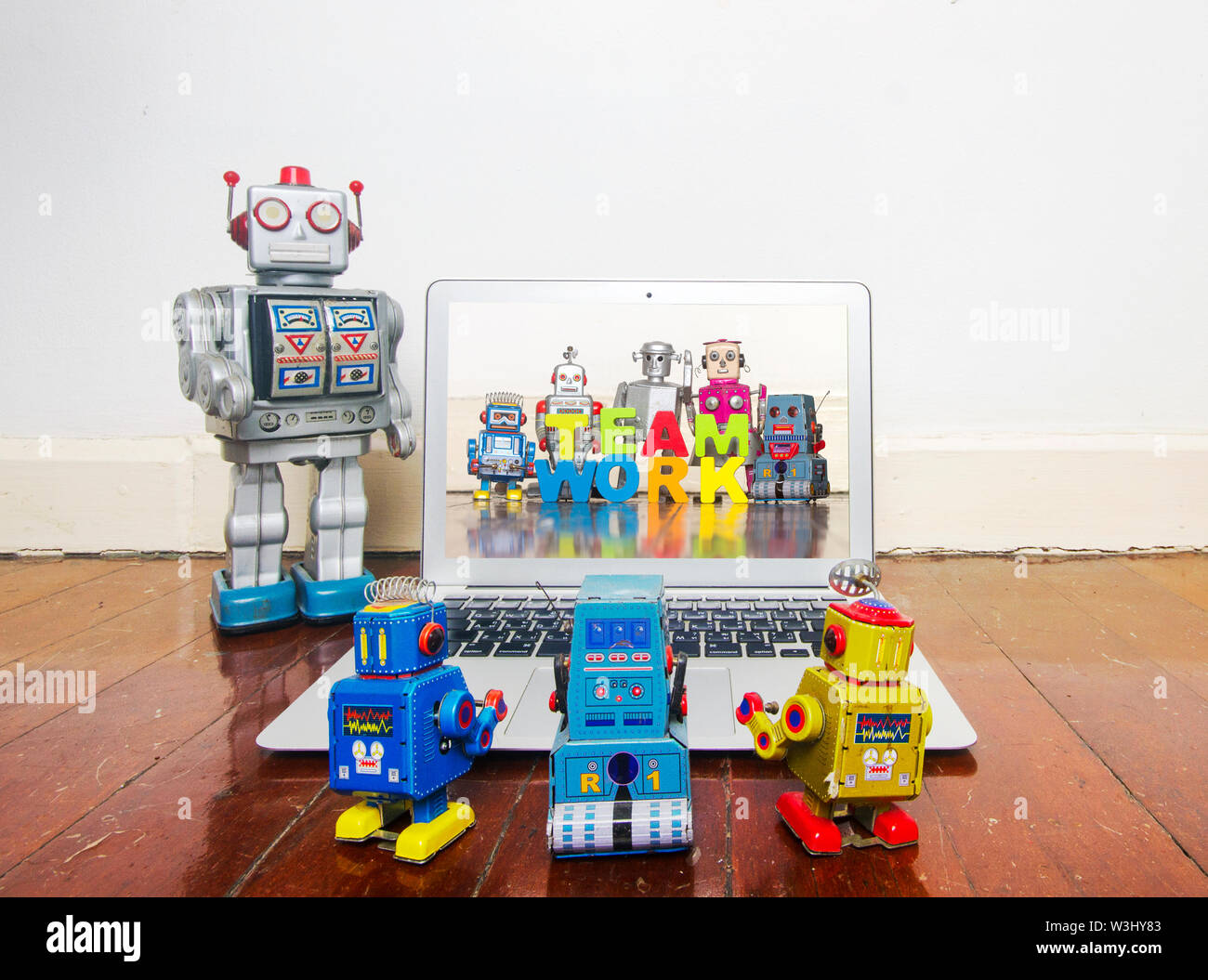 robot kids learn about team work on a laptop Stock Photo - Alamy