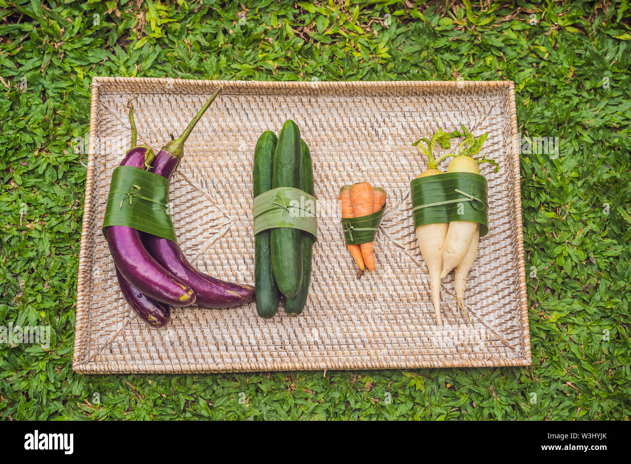 Eco-friendly product packaging concept. Vegetables wrapped in a banana ...