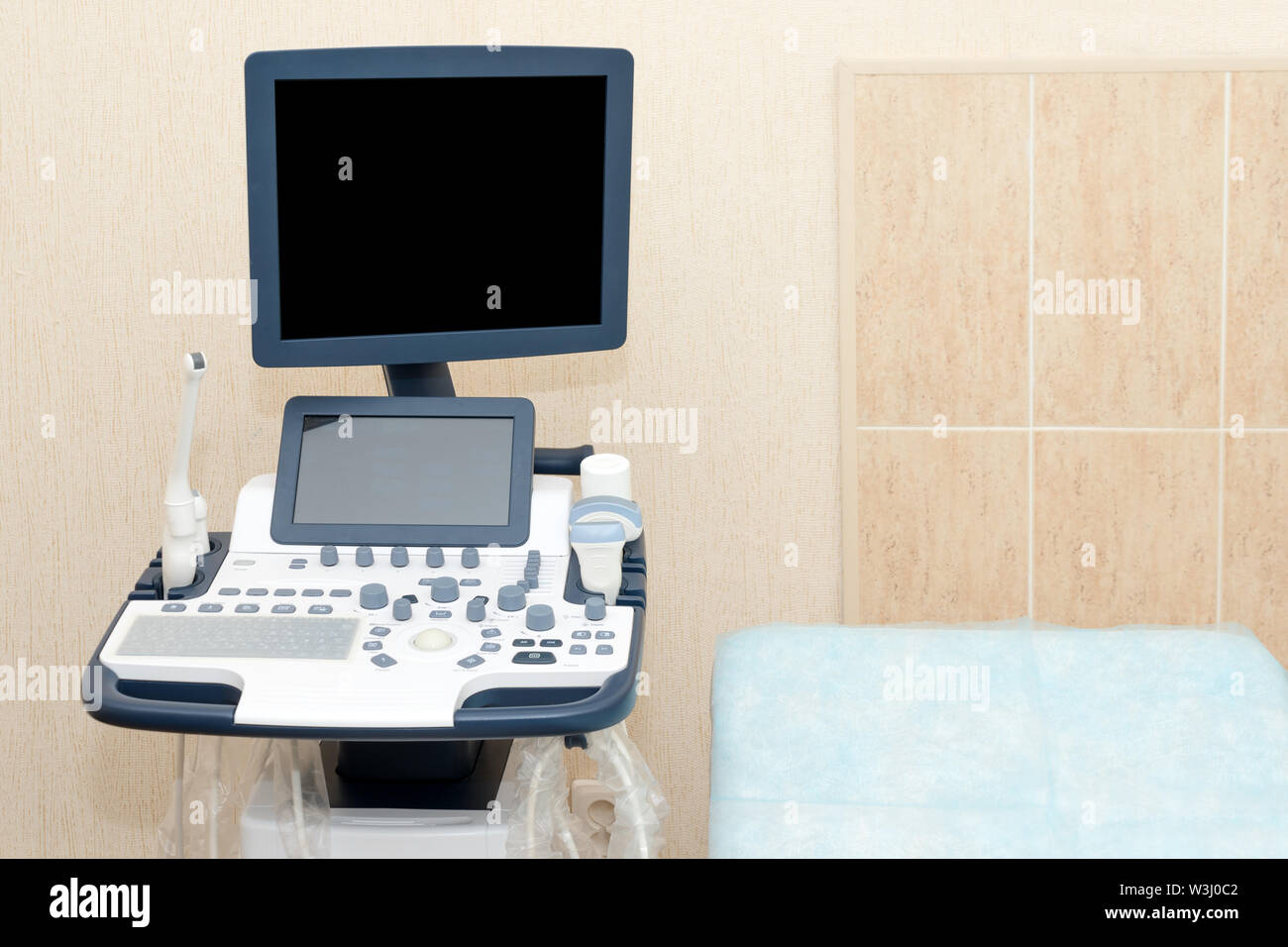 Interior of examination room with ultrasonography machine in hospital ...