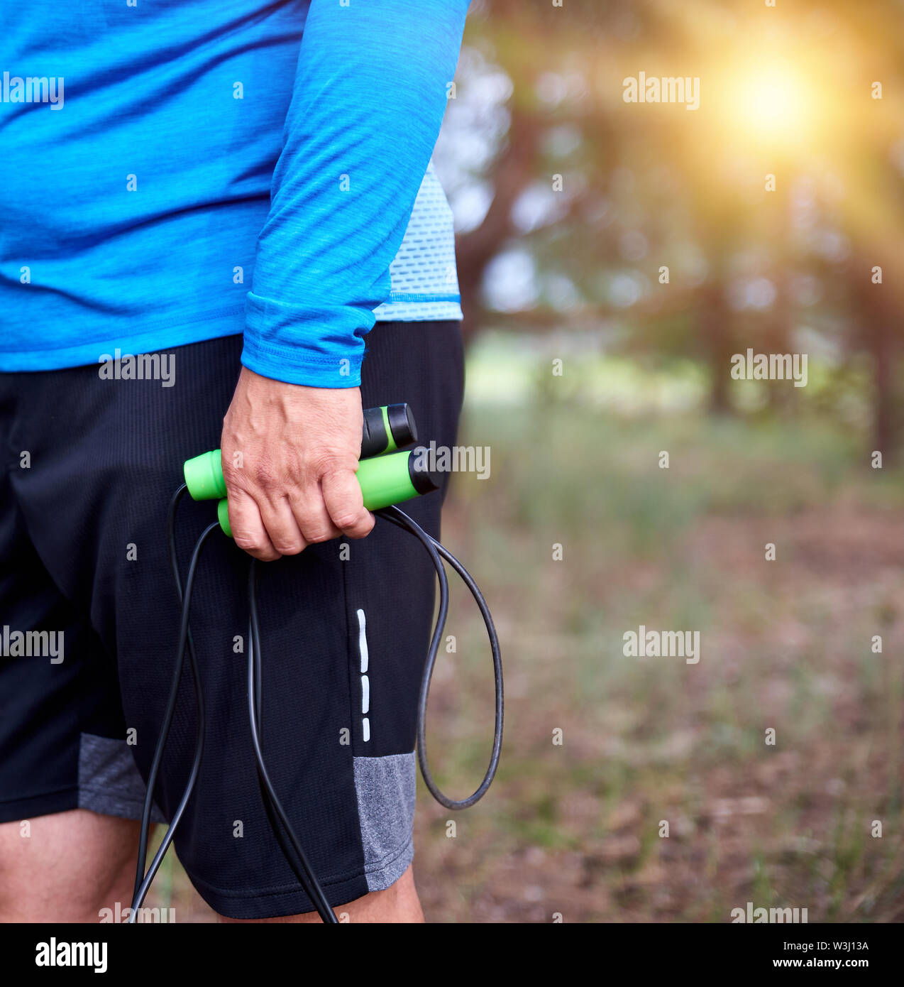 Man jumping rope in the sun hi-res stock photography and images - Alamy