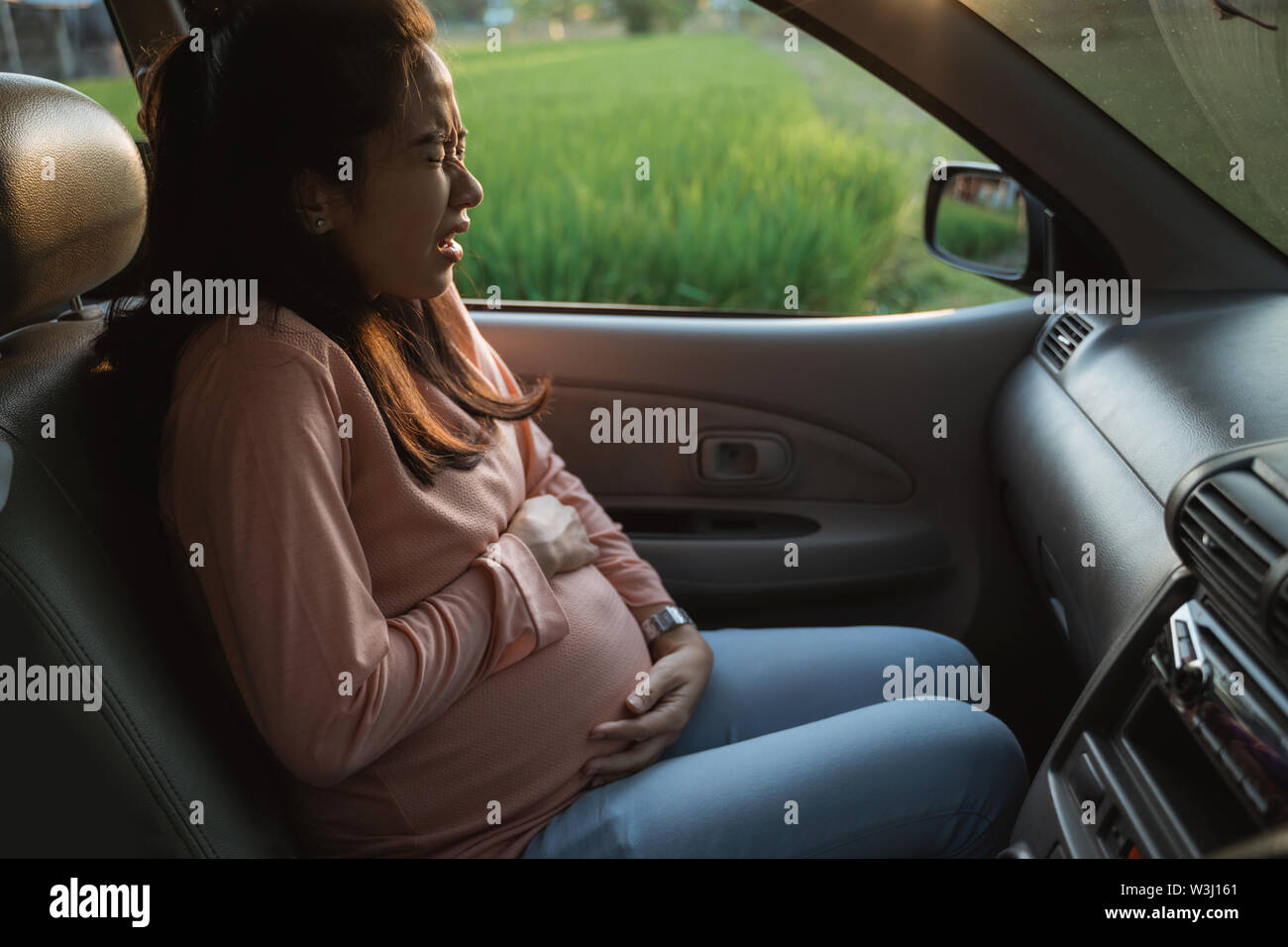 Worried mother feeling belly pain hi-res stock photography and images ...