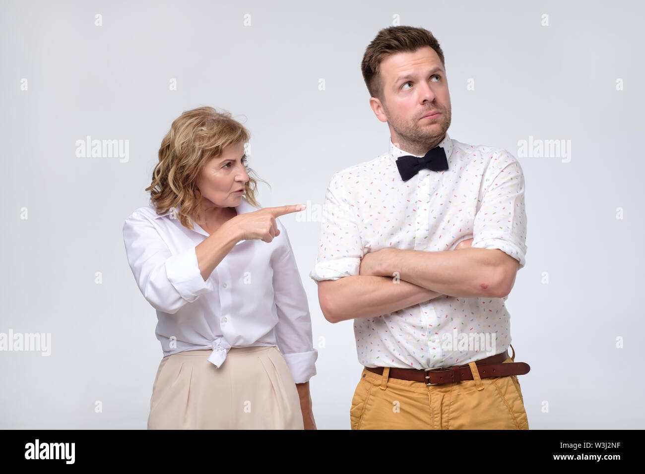 Image of sad businesswoman expelled by her manager, isolated on white ...