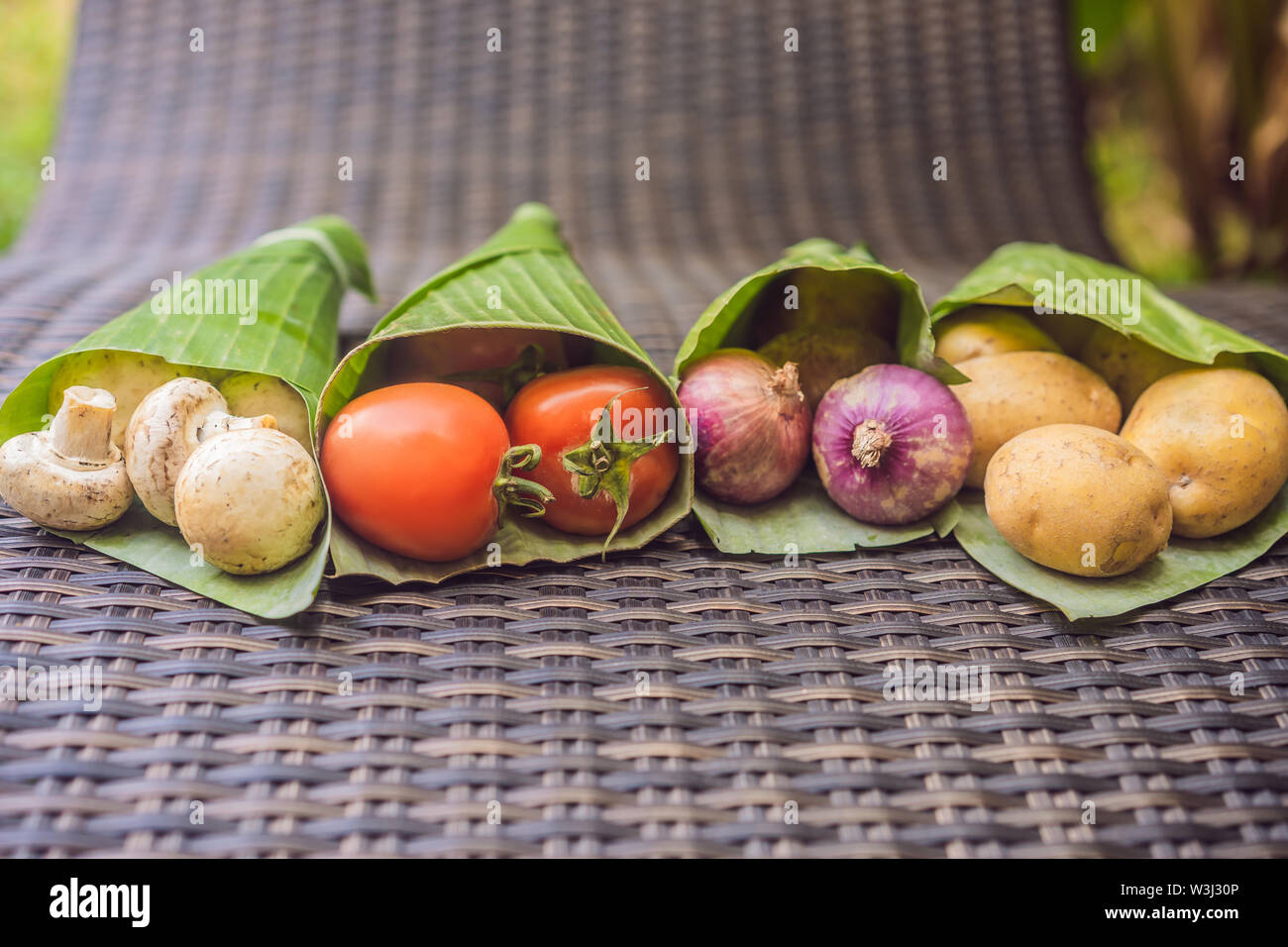 Eco-friendly product packaging concept. Vegetables wrapped in a banana ...