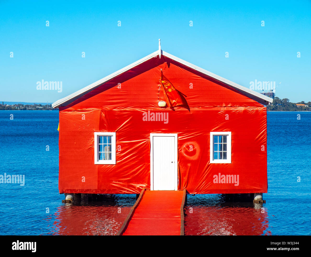 The iconic Crawley Edge Boatshed on the Swan River wrapped in red to ...