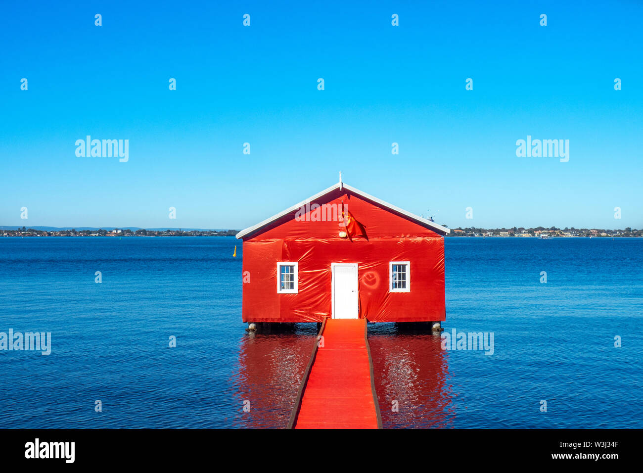The iconic Crawley Edge Boatshed on the Swan River wrapped in red to ...
