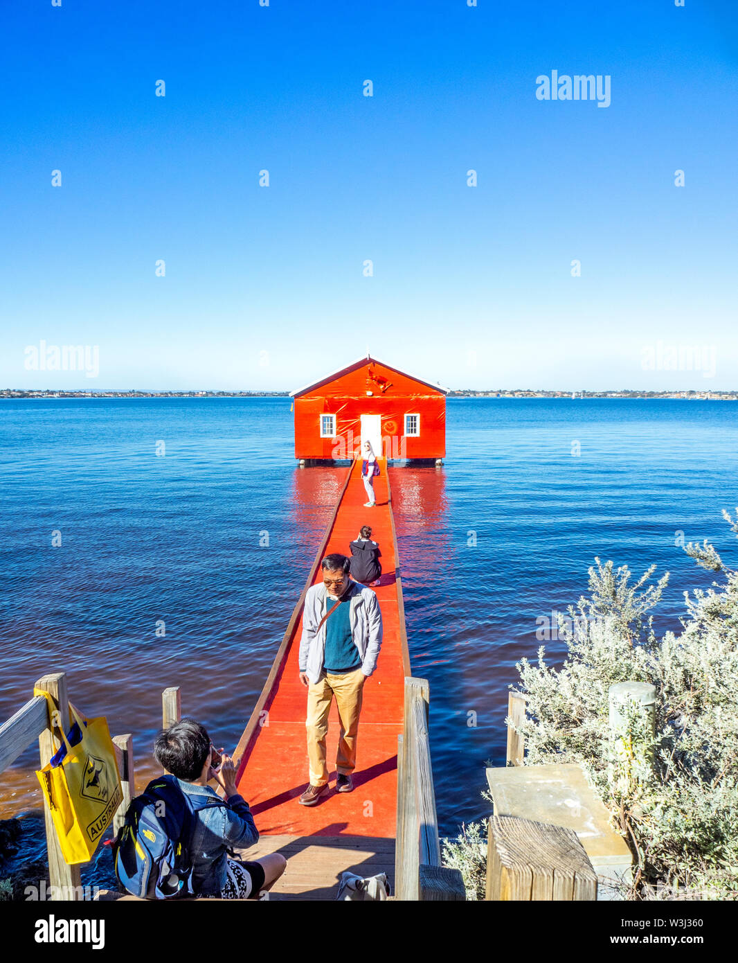 The iconic Crawley Edge Boatshed on the Swan River wrapped in red to ...