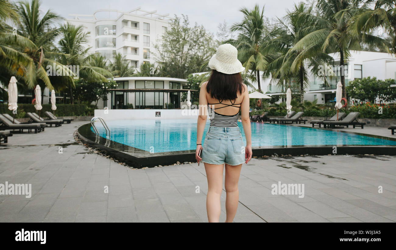 Female Figure Walks Toward a Pool Stock Photo - Alamy