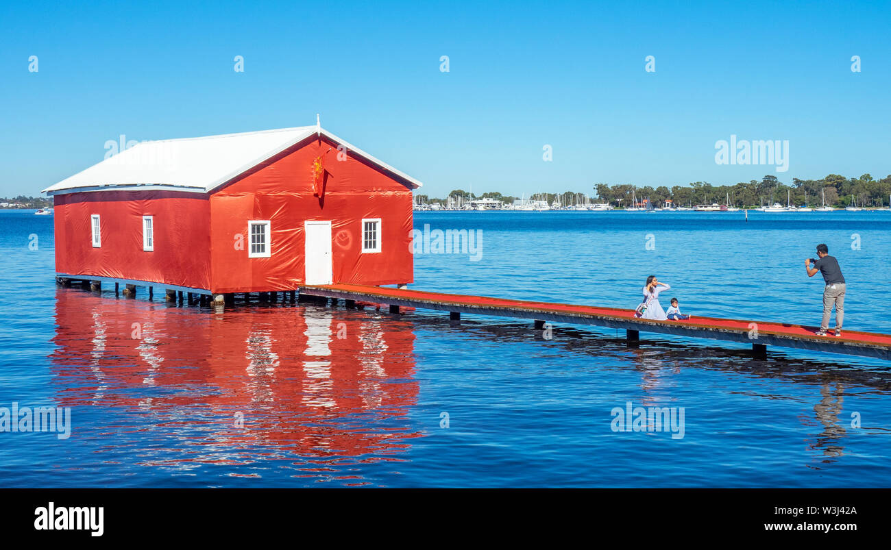 The iconic Crawley Edge Boatshed on the Swan River wrapped in red to ...