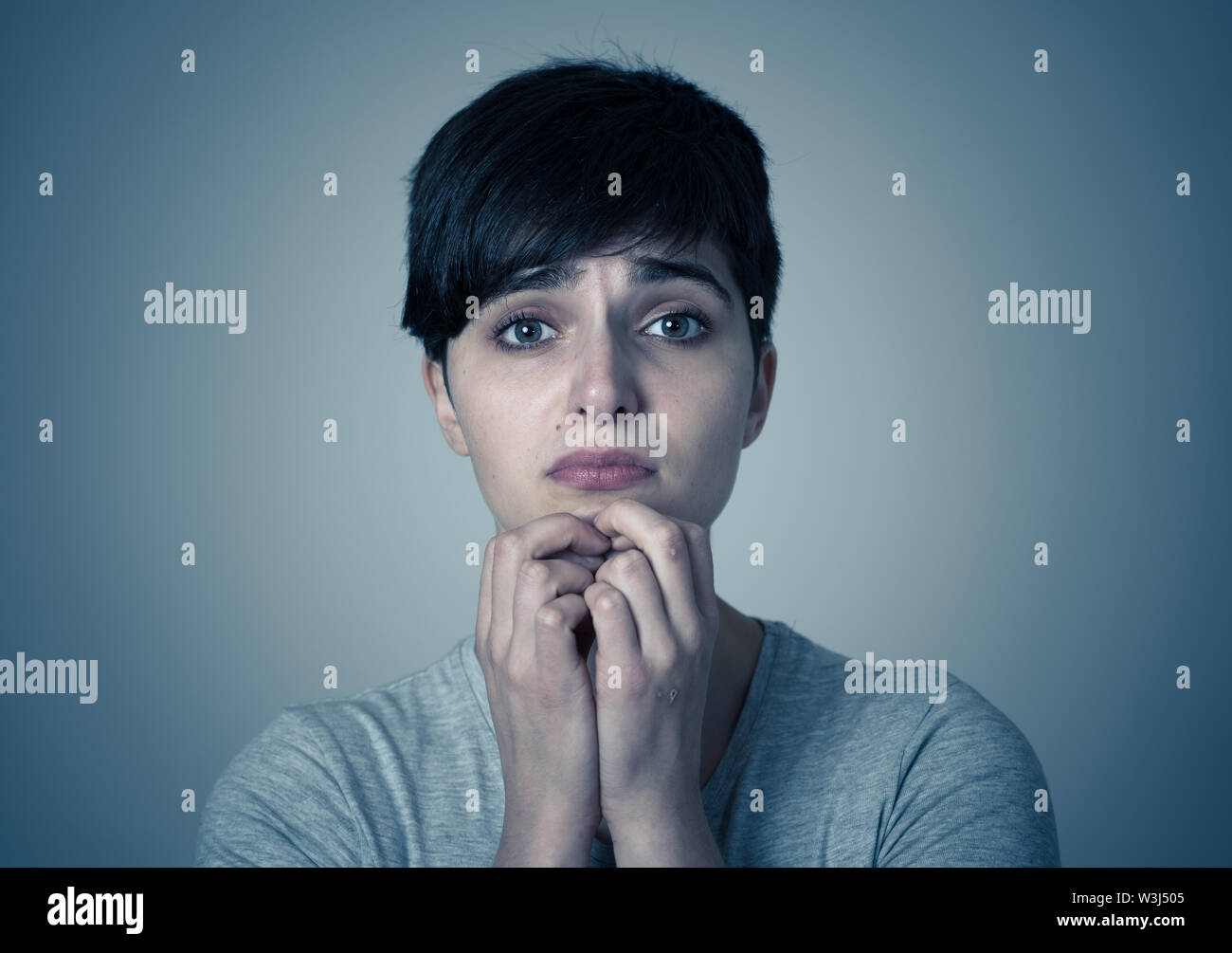 Close up portrait of beautiful young woman with sad eyes looking ...
