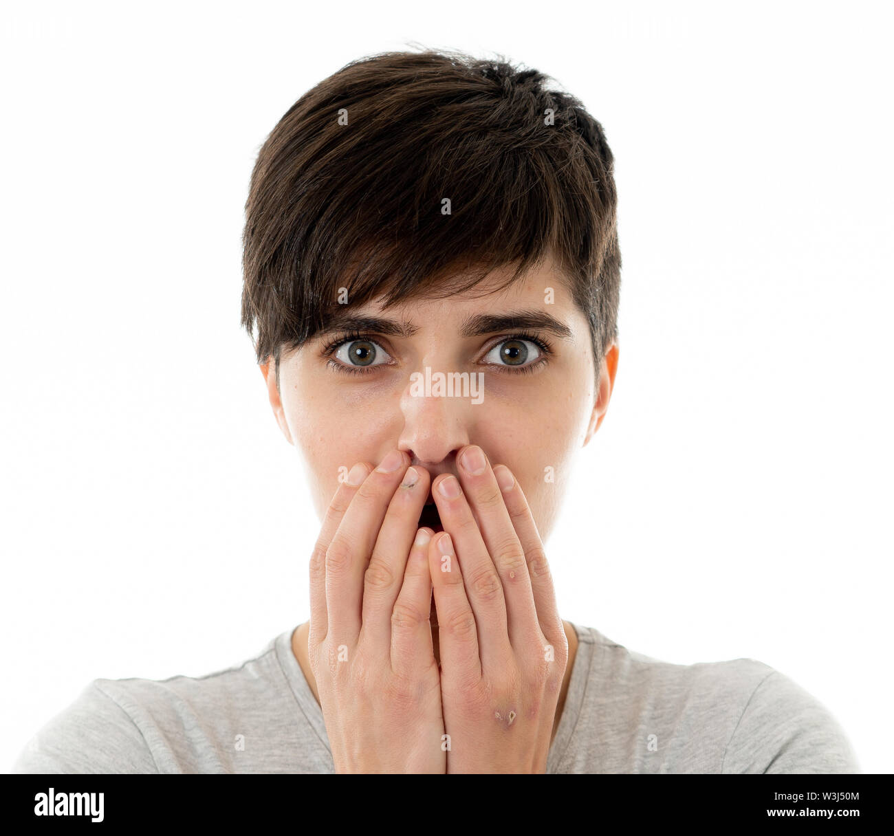 Close up portrait of young woman feeling horrified and shocked looking ...