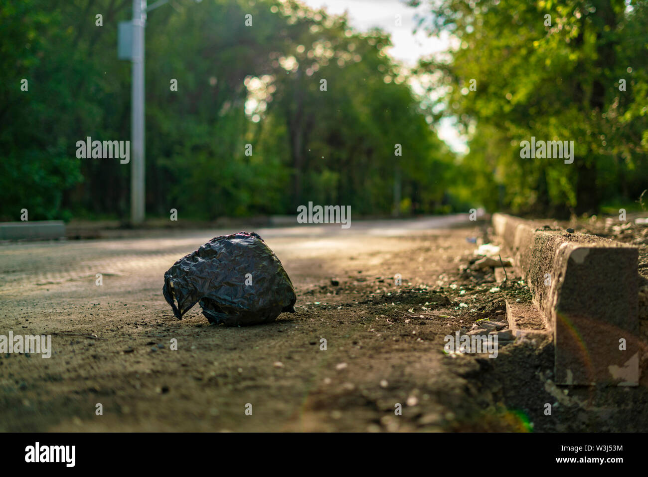 plastic garbage on the ground outdoor in the street Stock Photo - Alamy