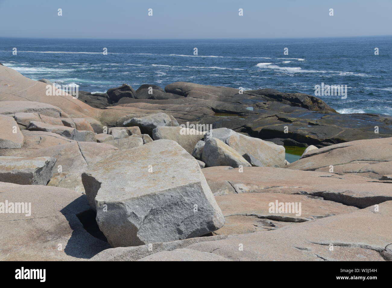 Sea and granite shoreline Stock Photo - Alamy