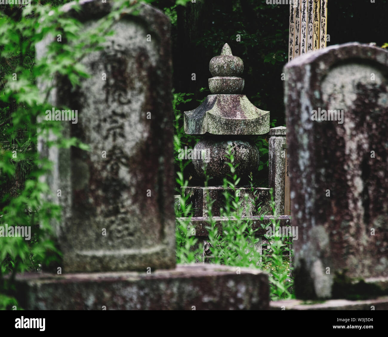 picture of small stone shrines in a japanese garden, mystic atmosphere ...