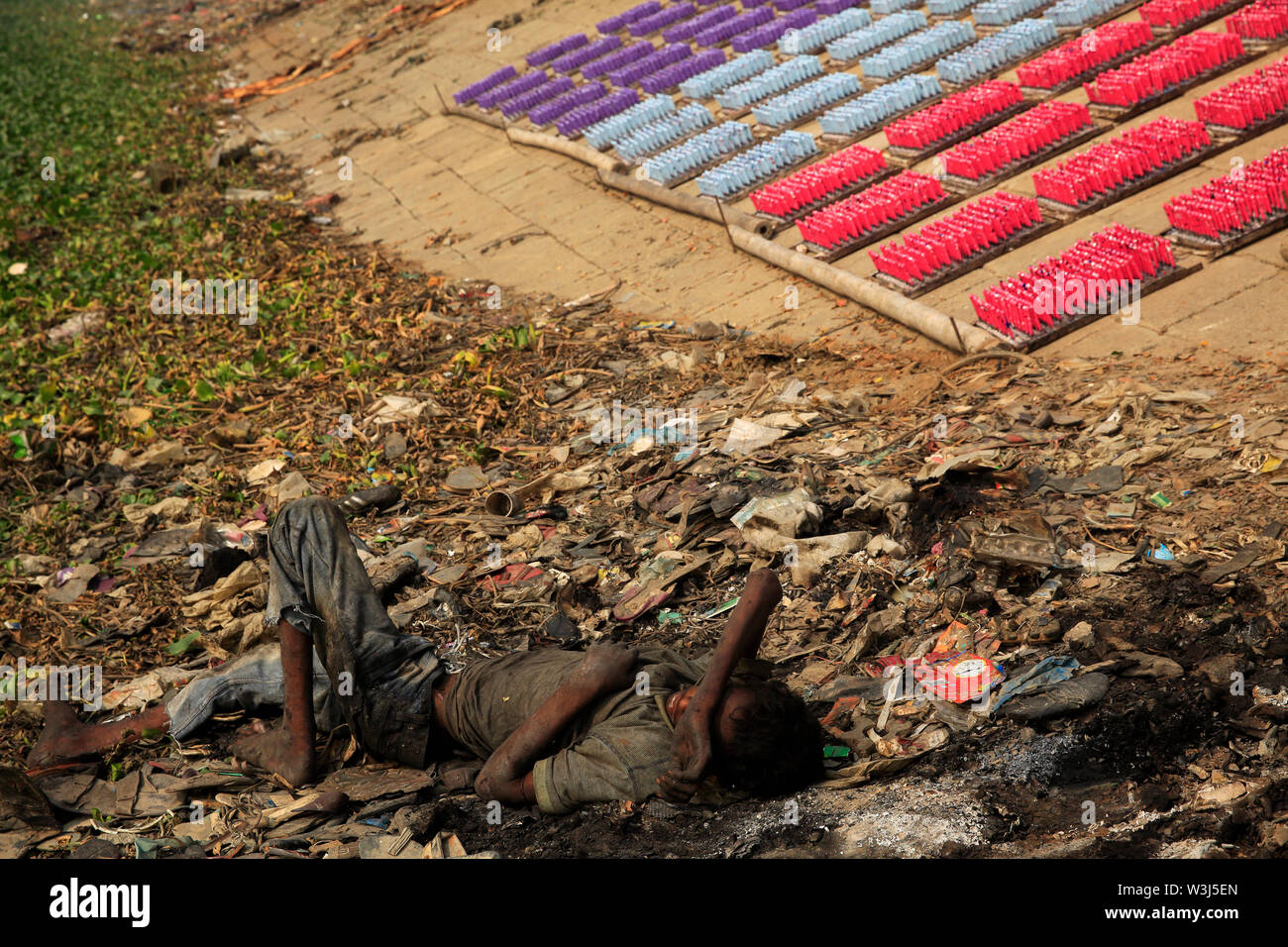Drying racks of rubber balloon under the sun on the bank of Buriganga ...