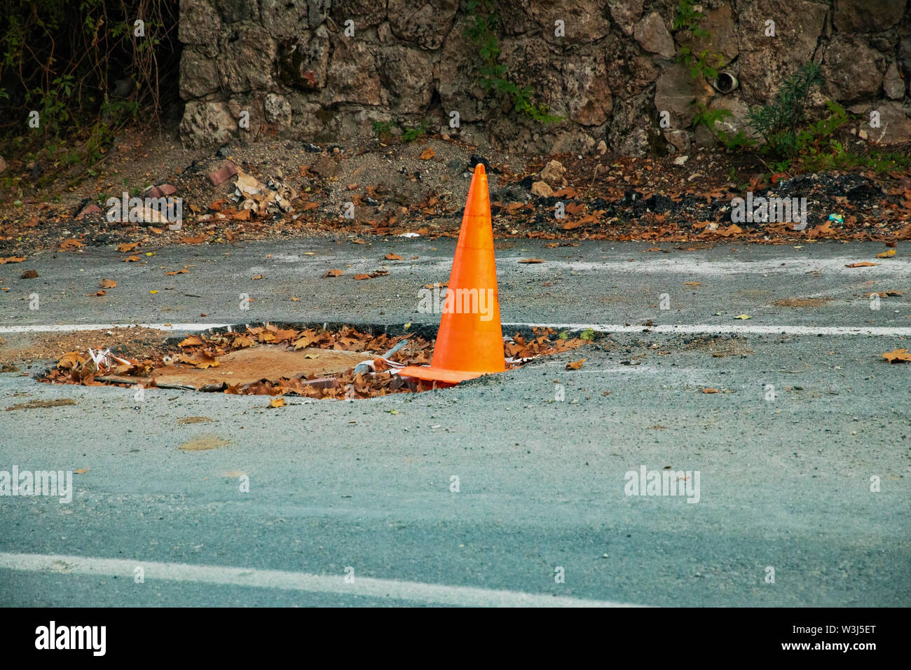 Emergency orange cone road pit fencing. Fencing road repair of ...