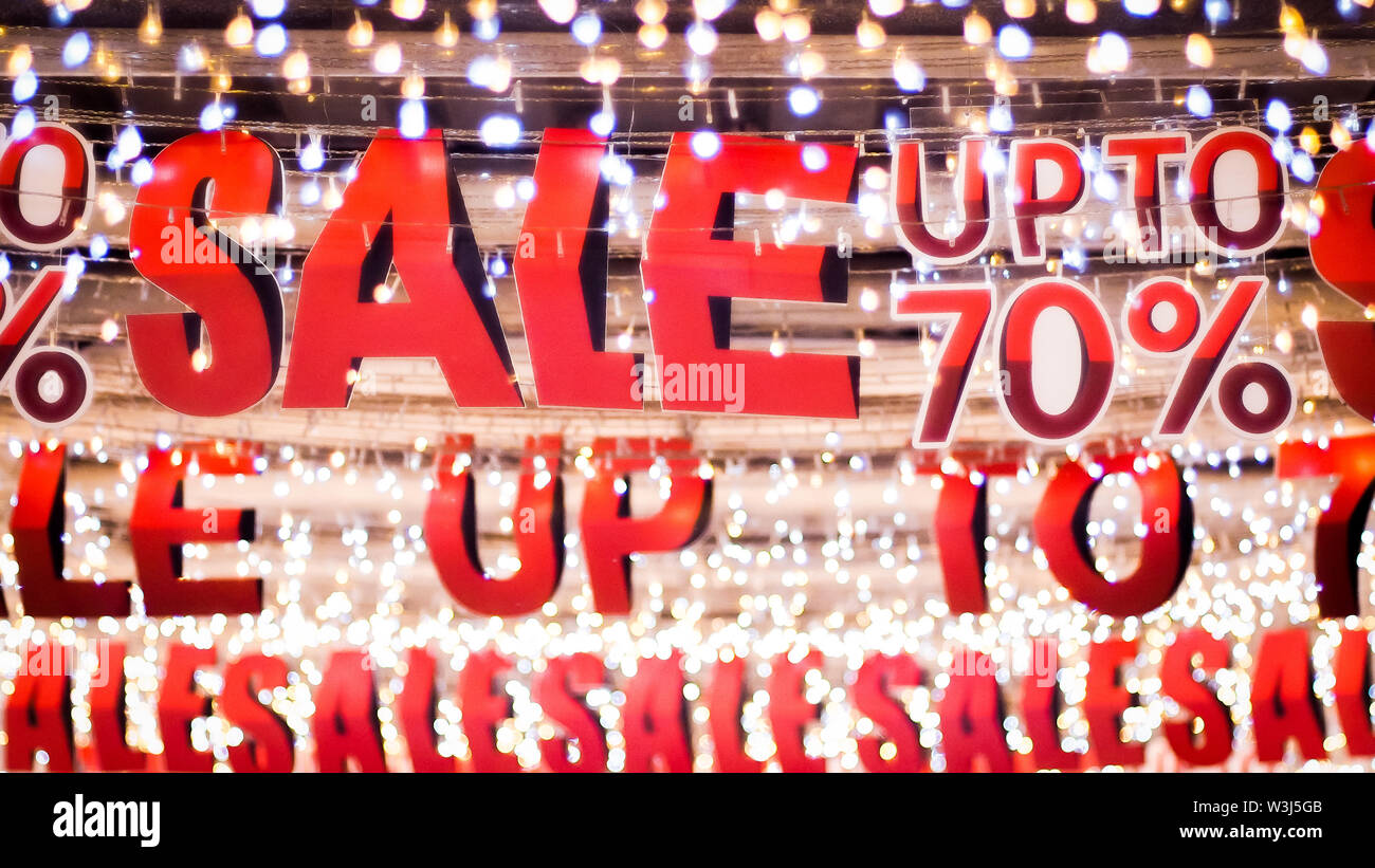 Store sale sign. Special offer banner with the red sale text gold bokeh ...