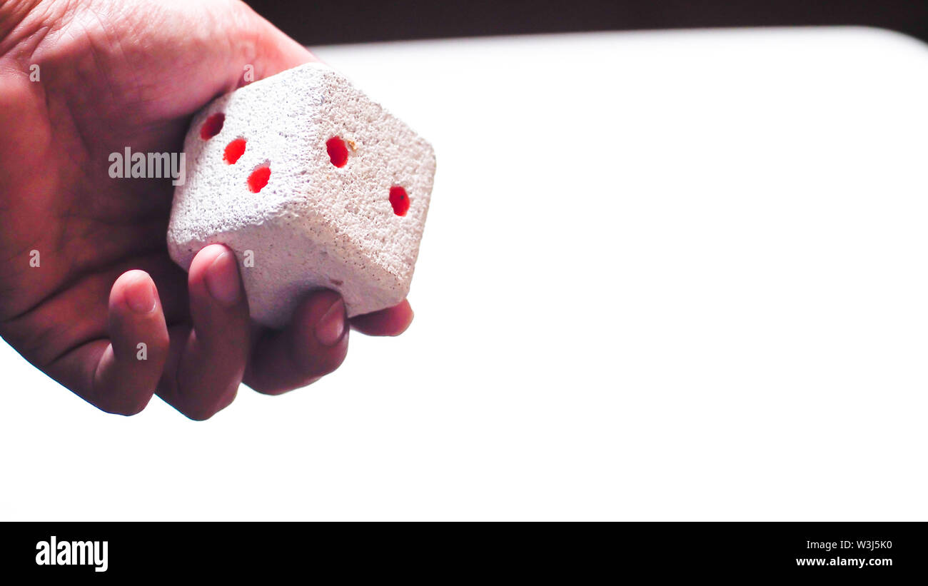 Hand & Rolling Dice. Hand rolls a dices on white isolated background ...